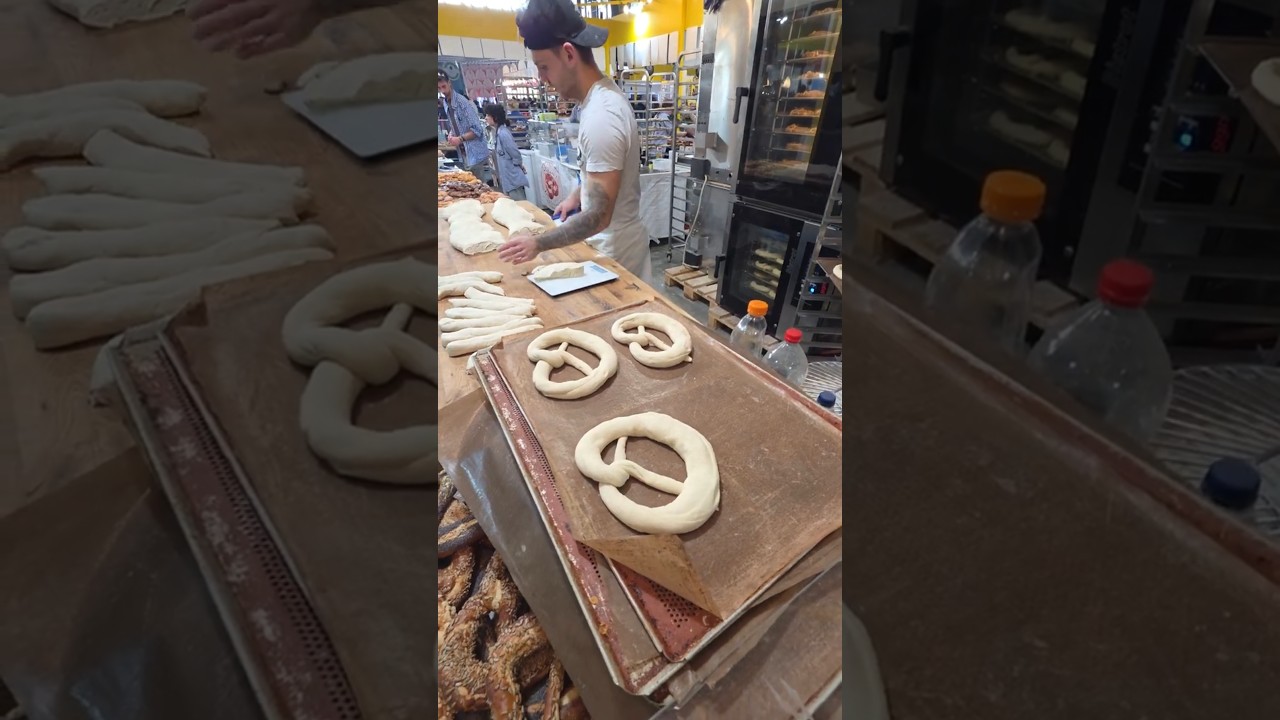 Making and Baking Big German Pretzels. Italy Food Festival - Italian Food